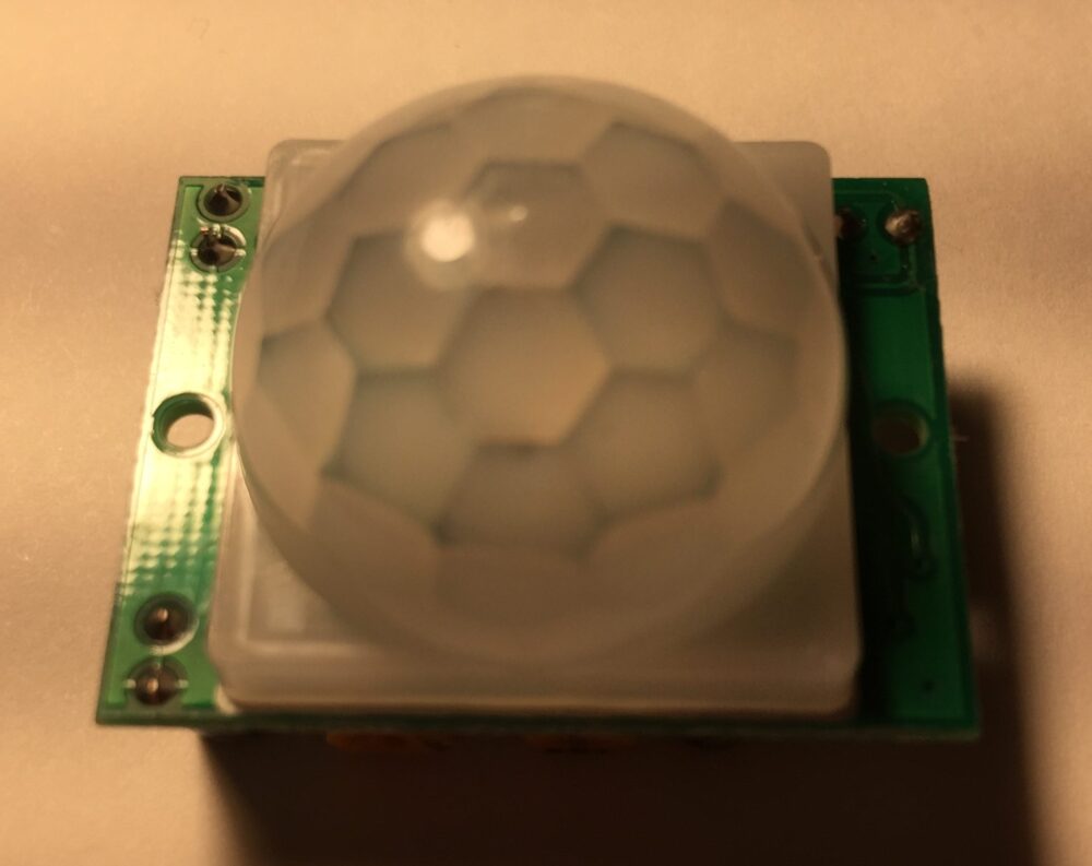 Connecting and uploading the code for the PIR motion sensor.
